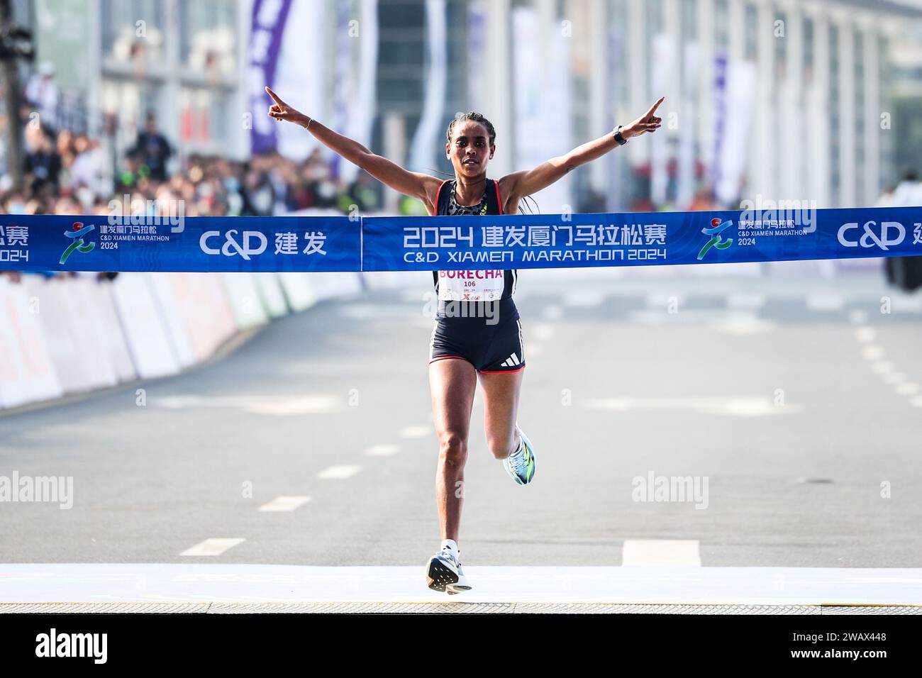 Xiamen. 7th Jan, 2024. Bekelech Gudeta Borecha of Ethiopia crosses the ...