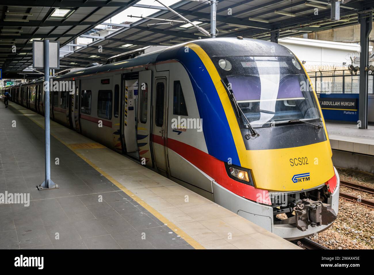 A stationary KTM Komiuter train at Abdullah Hukum station, Kuala Lumpur ...