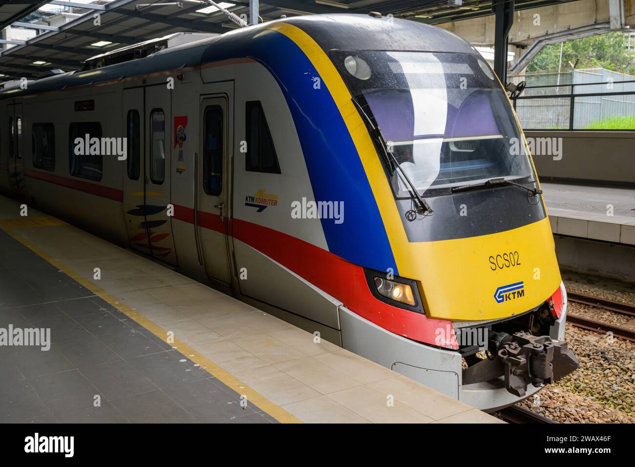 A departing KTM Komiuter train at Abdullah Hukum station, Kuala Lumpur ...