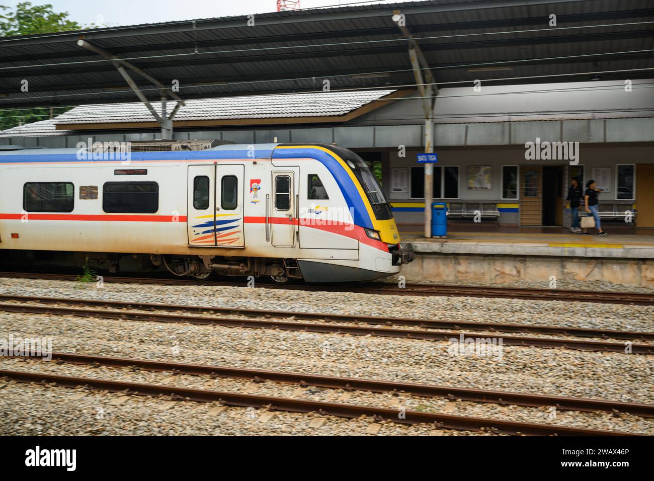 An arriving KTM Komuter train at Batu Tiga Station, Shah Alam, Selangor ...
