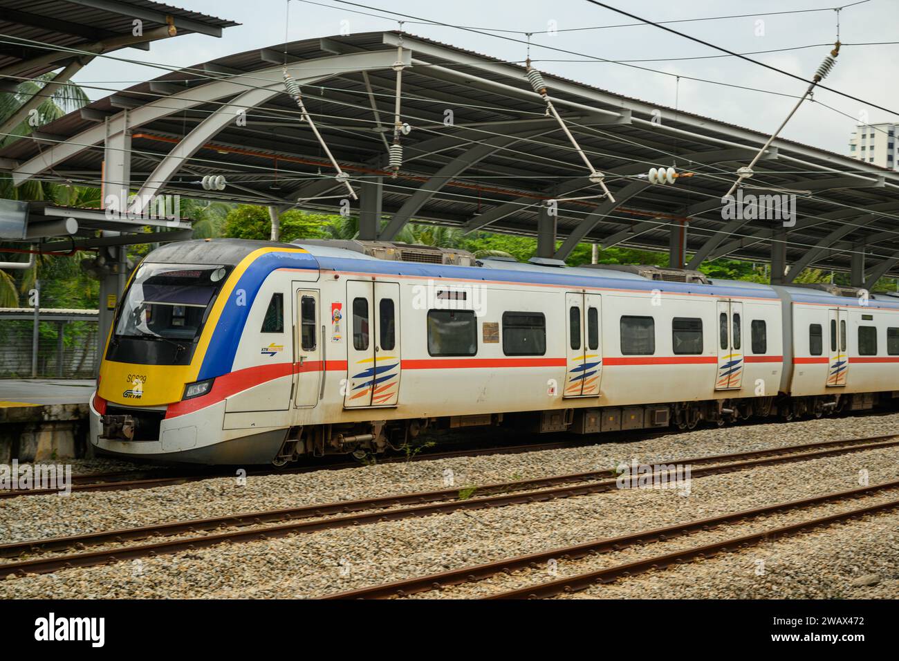 A departing KTM Komuter train at Batu Tiga Station, Shah Alam, Selangor ...