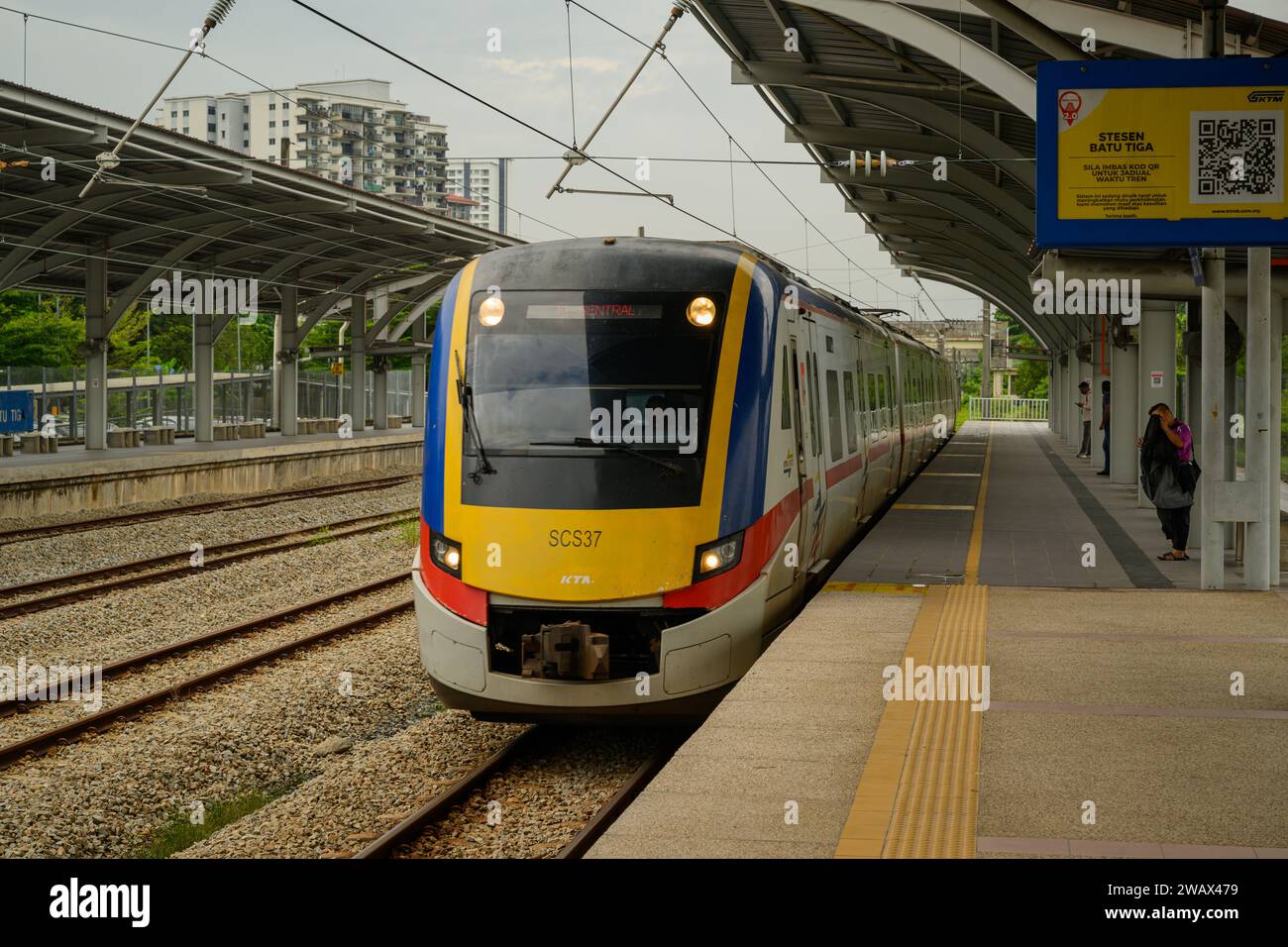 An arriving KTM Komuter train at Batu Tiga Station, Shah Alam, Selangor ...