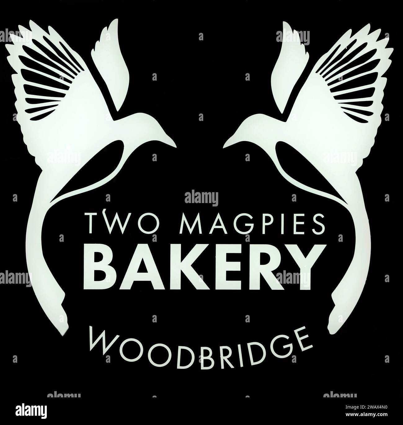 Logo sign on glass window, Two Magpies bakery, Woodbridge, Suffolk ...