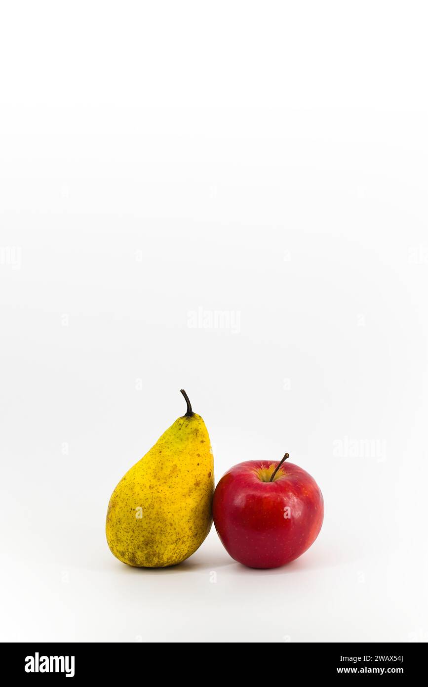 A vibrant image showcasing a yellow pear and a red apple on a pristine ...
