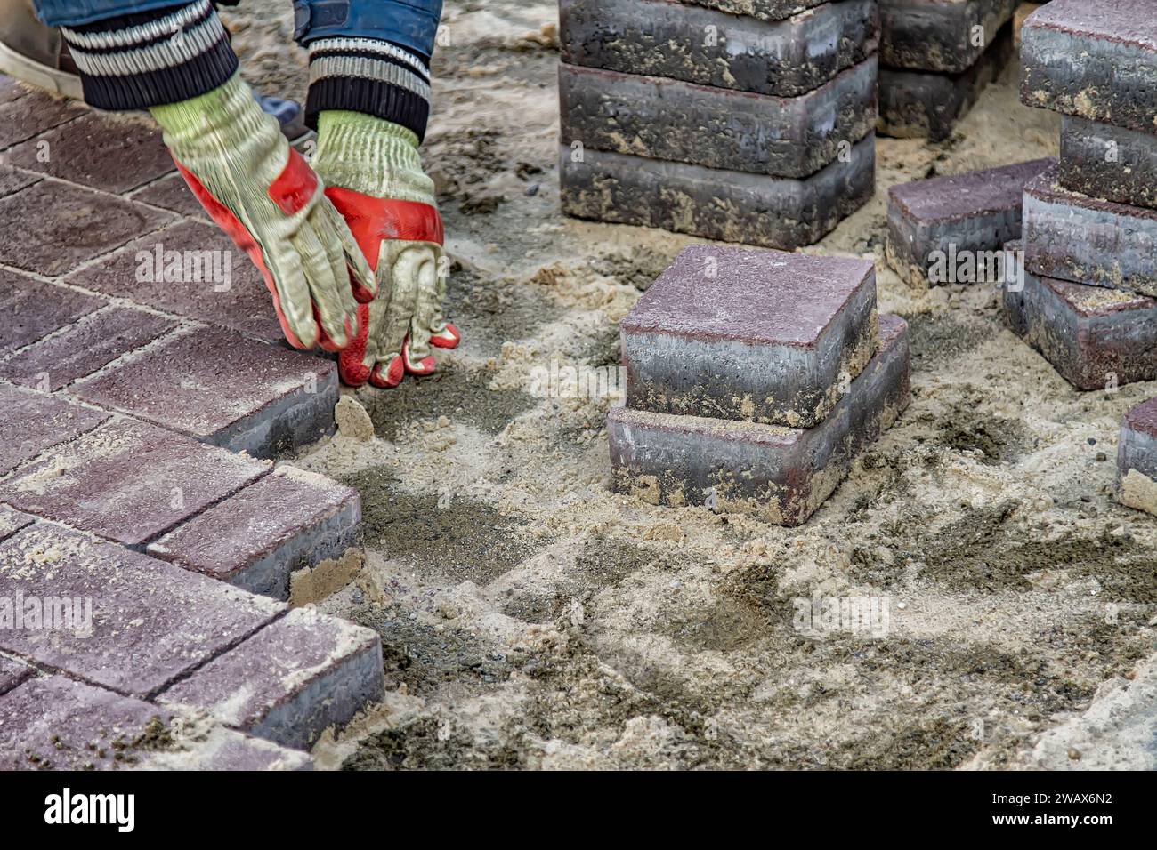 worker laying paving slabs on the street Stock Photo - Alamy