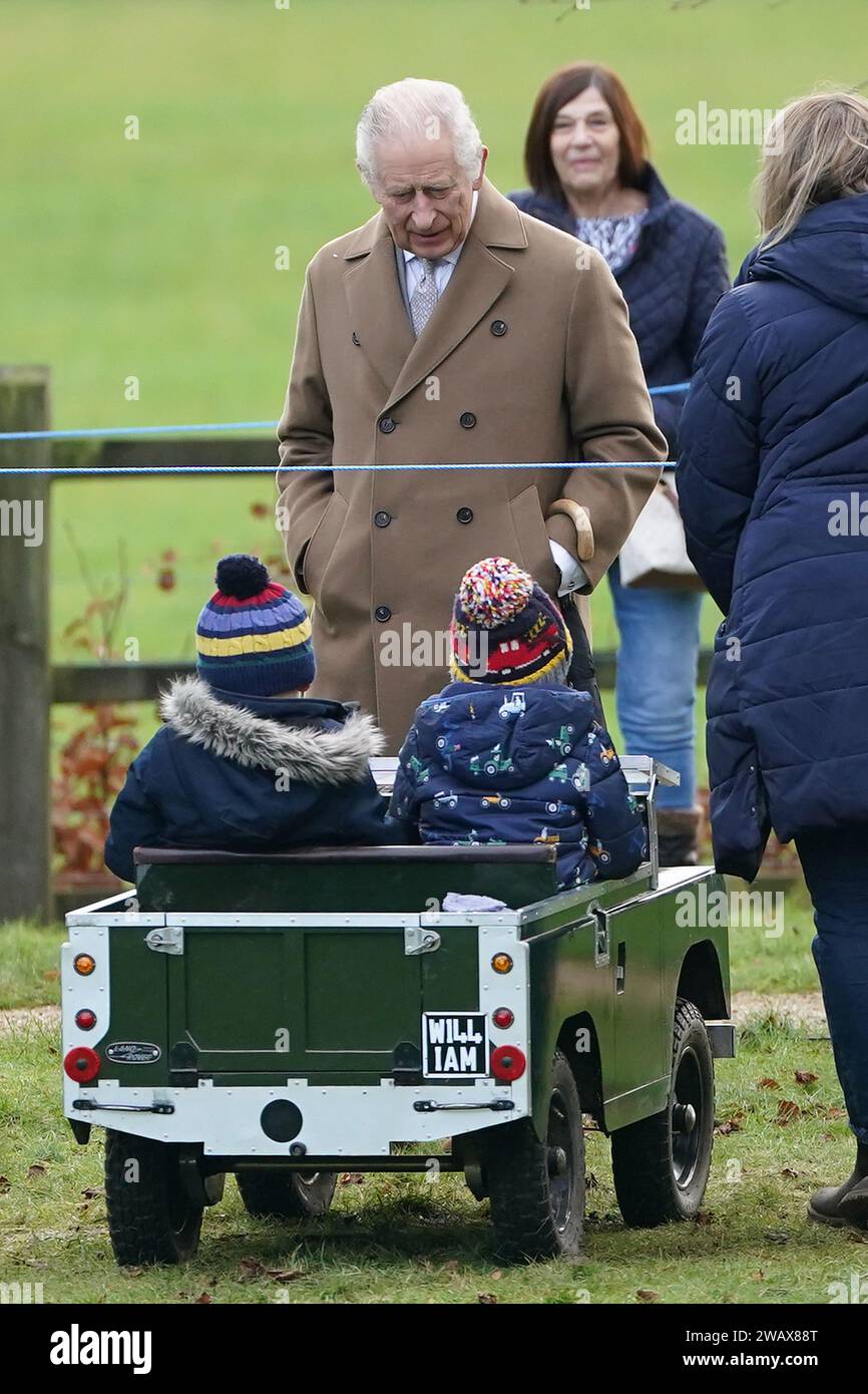 King Charles III talks to William and Oliver Ward after attending a ...