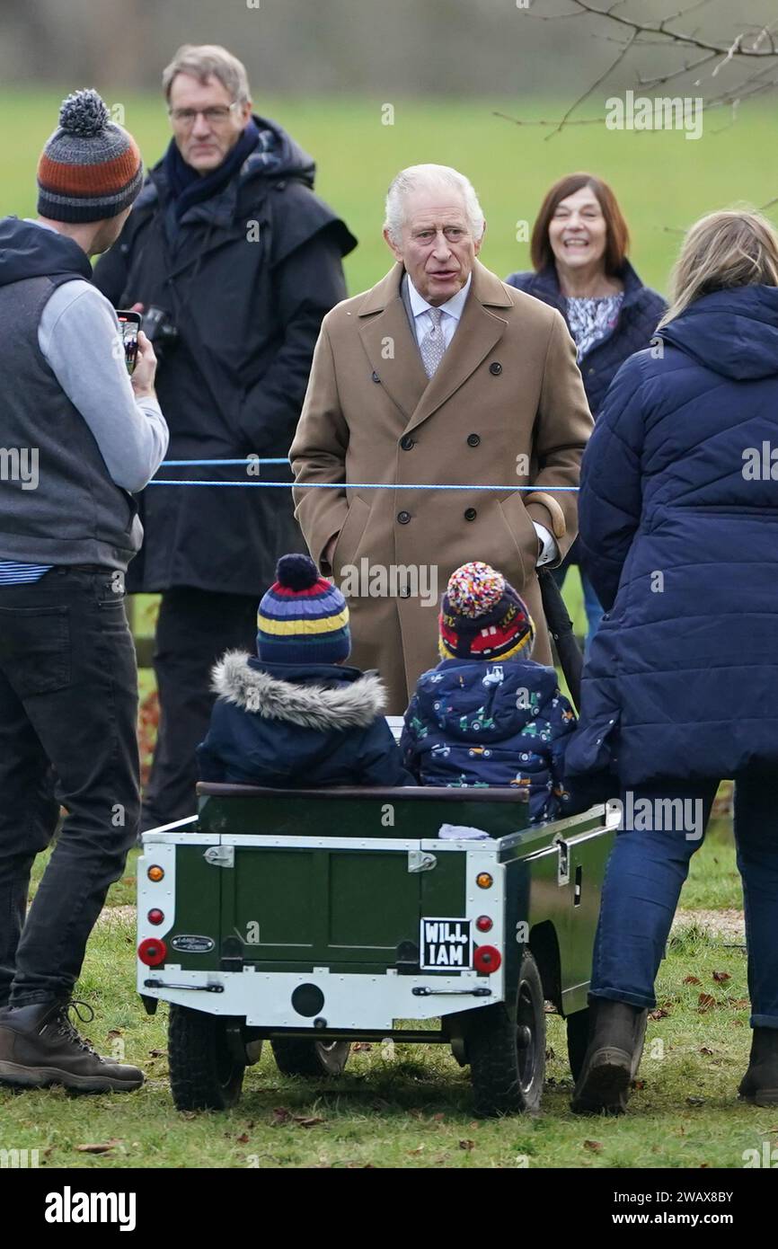 King Charles III talks to Simon and Georgina Ward and their sons ...