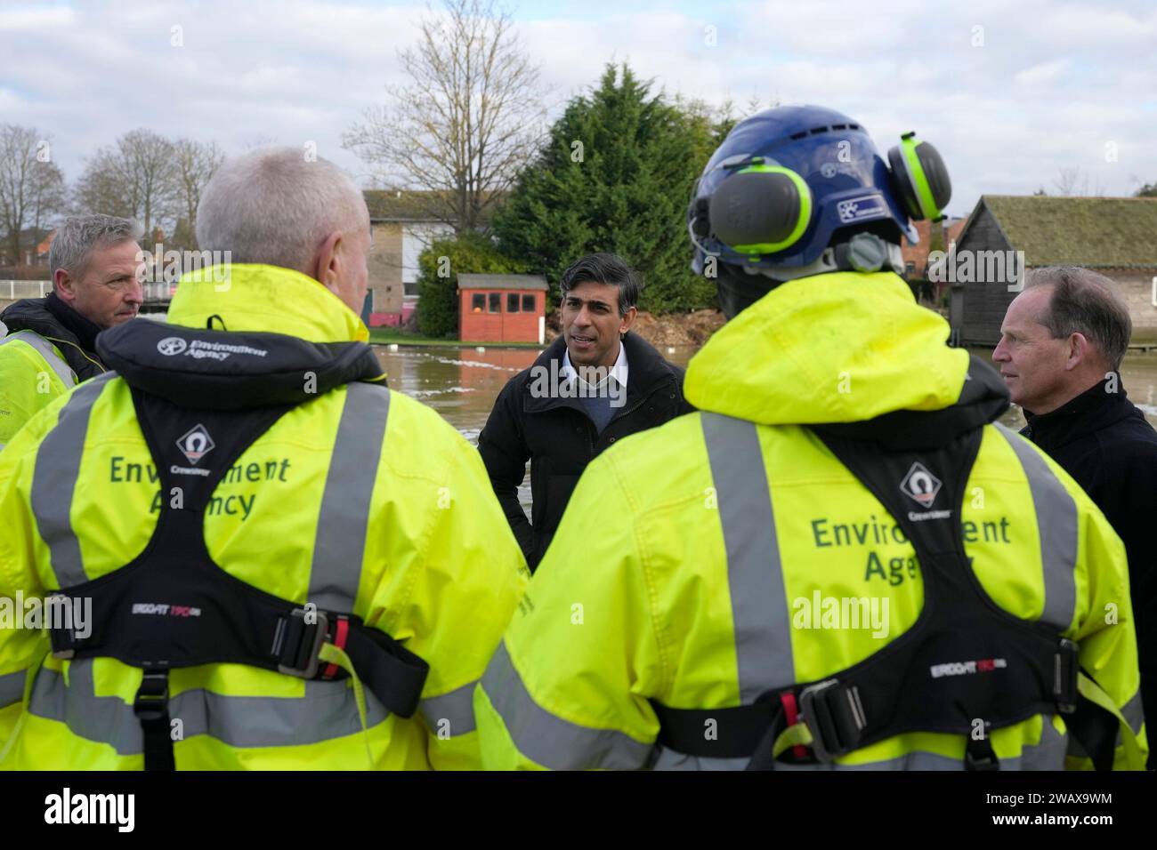 Prime Minister Rishi Sunak speaks to members of the Environment Agency as he looks at flood ...