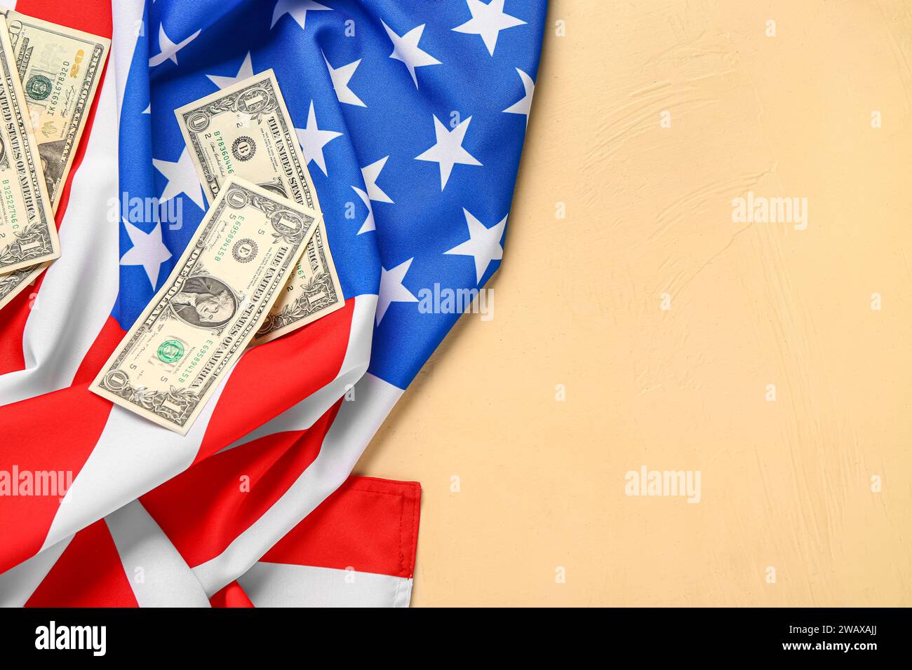 Flag of USA and dollar banknotes on yellow background Stock Photo - Alamy
