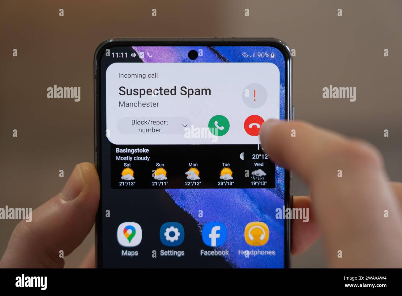 A person about to hang up on an incoming phone call listed as ...