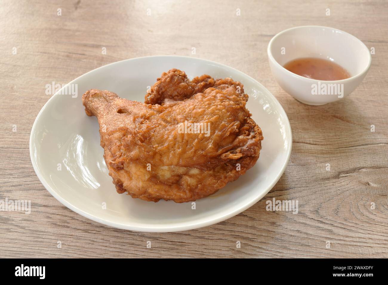 crispy fried chicken tight and leg on plate dipping sweet chili sauce ...