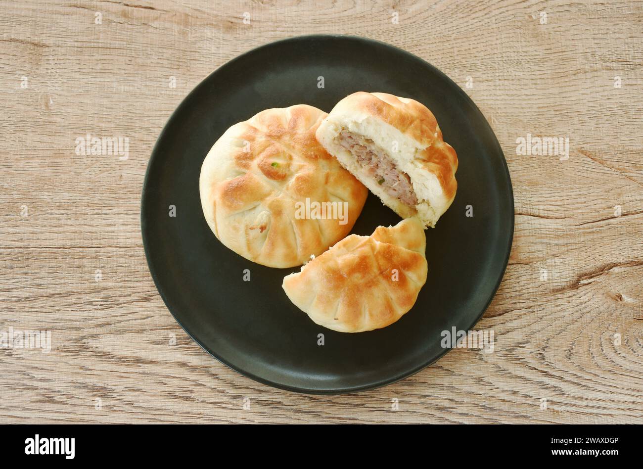 grilled bao Chinese bun stuffing mashed pork on plate eat couple hot ...