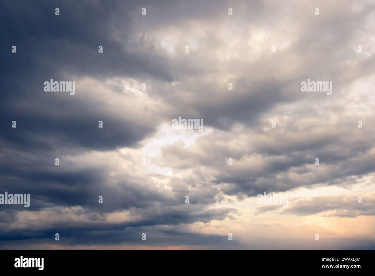 The sky is overcast with thick, grey stormy clouds looming overhead ...