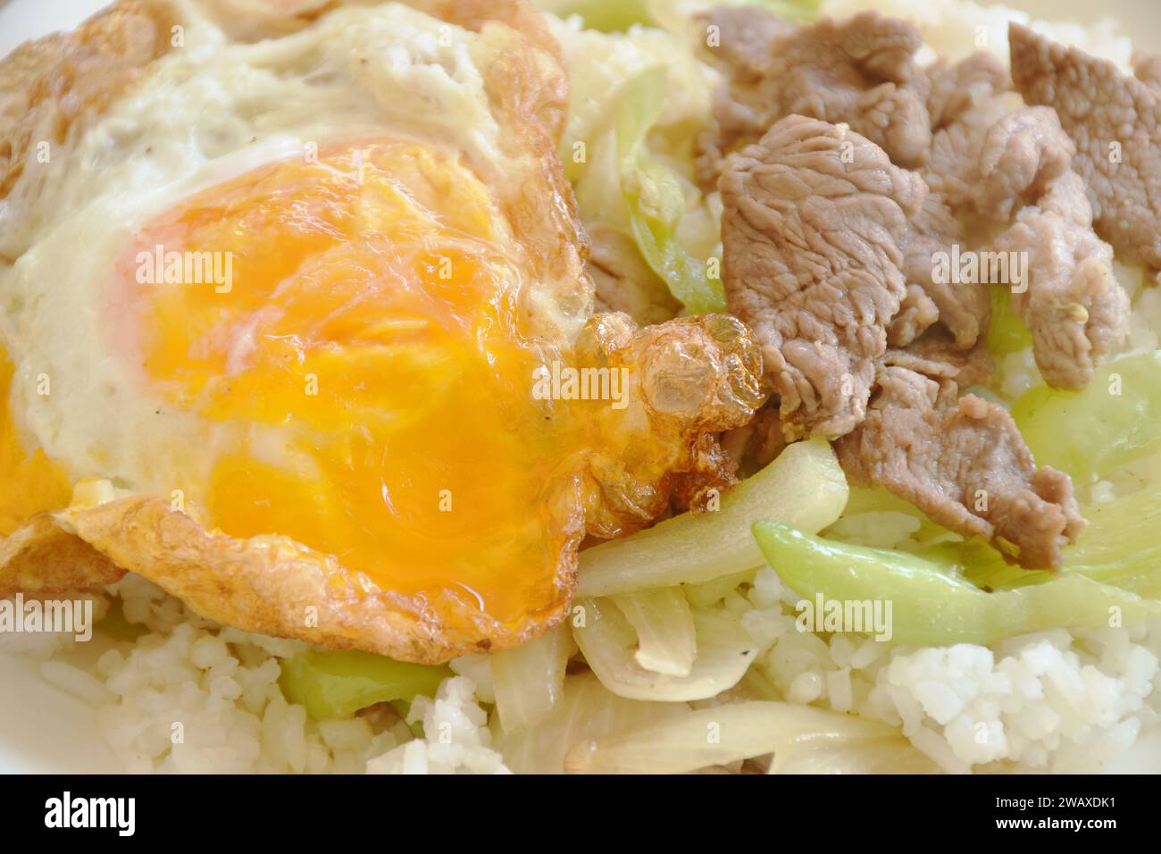 spicy stir fried slice beef meat with long sweet chili and onion on ...