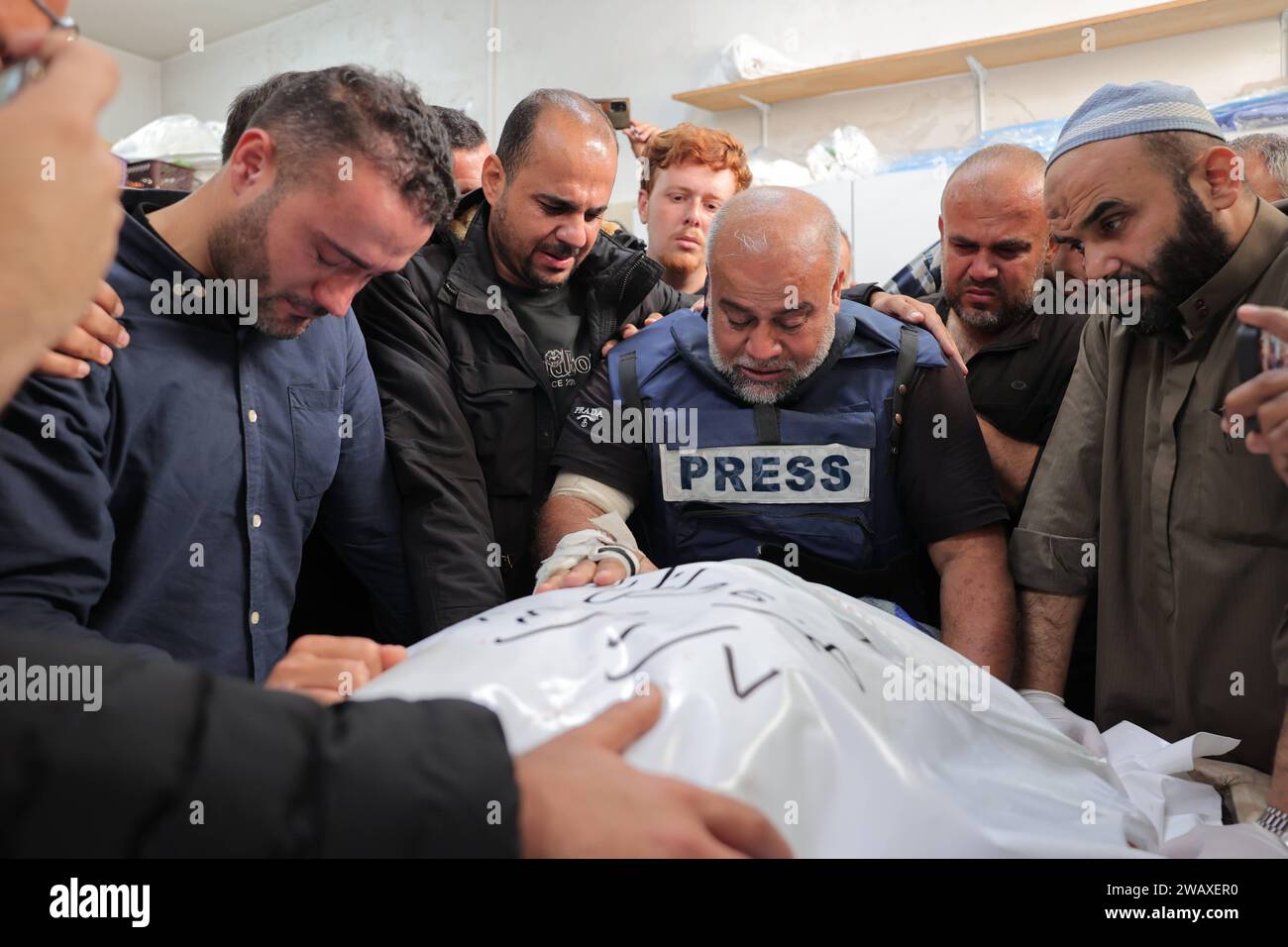 Palestinians attend in the funeral of Hamza Wael Dahdouh, a journalist ...