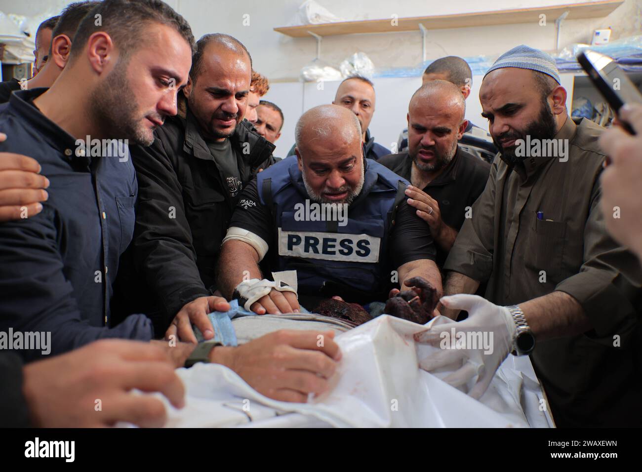 Palestinians attend in the funeral of Hamza Wael Dahdouh, a journalist ...