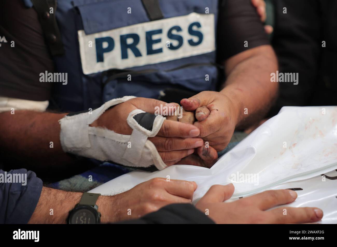 Palestinians attend in the funeral of Hamza Wael Dahdouh, a journalist ...