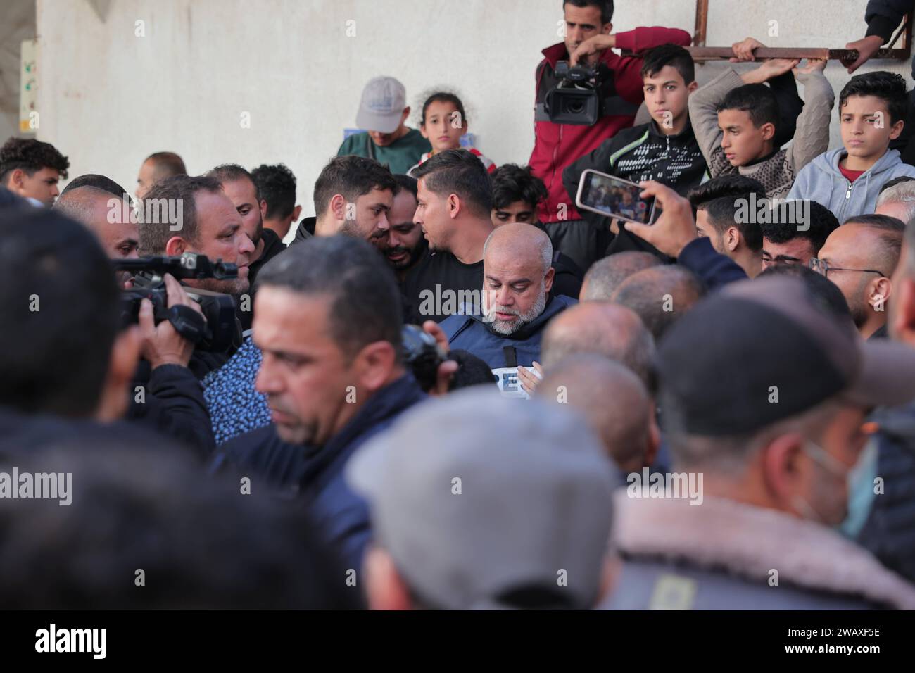 Palestinians attend in the funeral of Hamza Wael Dahdouh, a journalist ...