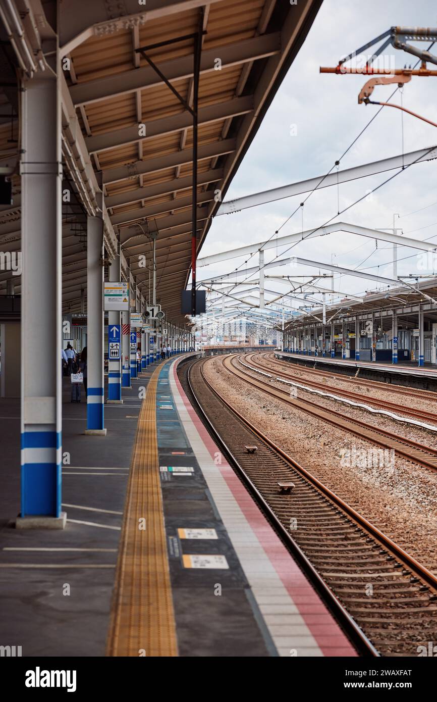 View along train platform and tracks at Fukuyama Station; Fukuyama ...