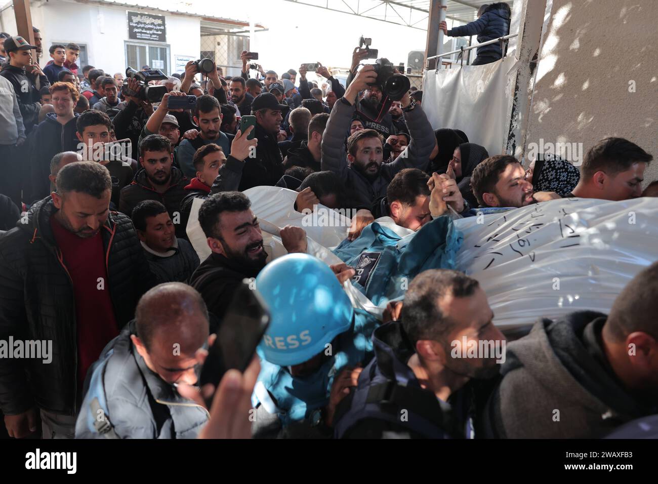 Palestinians attend in the funeral of Hamza Wael Dahdouh, a journalist ...
