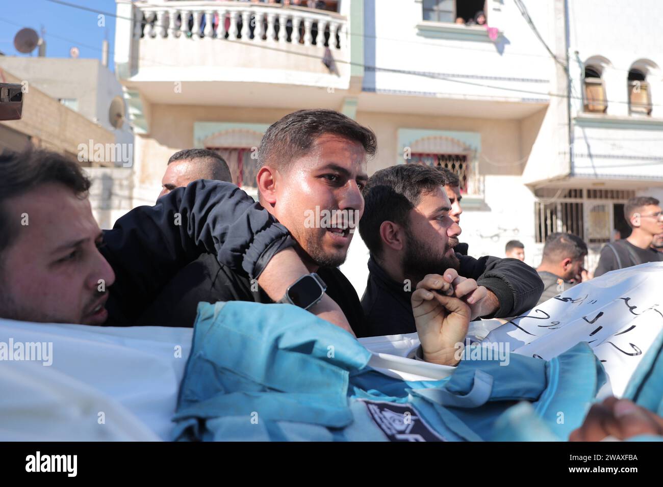 Palestinians attend in the funeral of Hamza Wael Dahdouh, a journalist ...