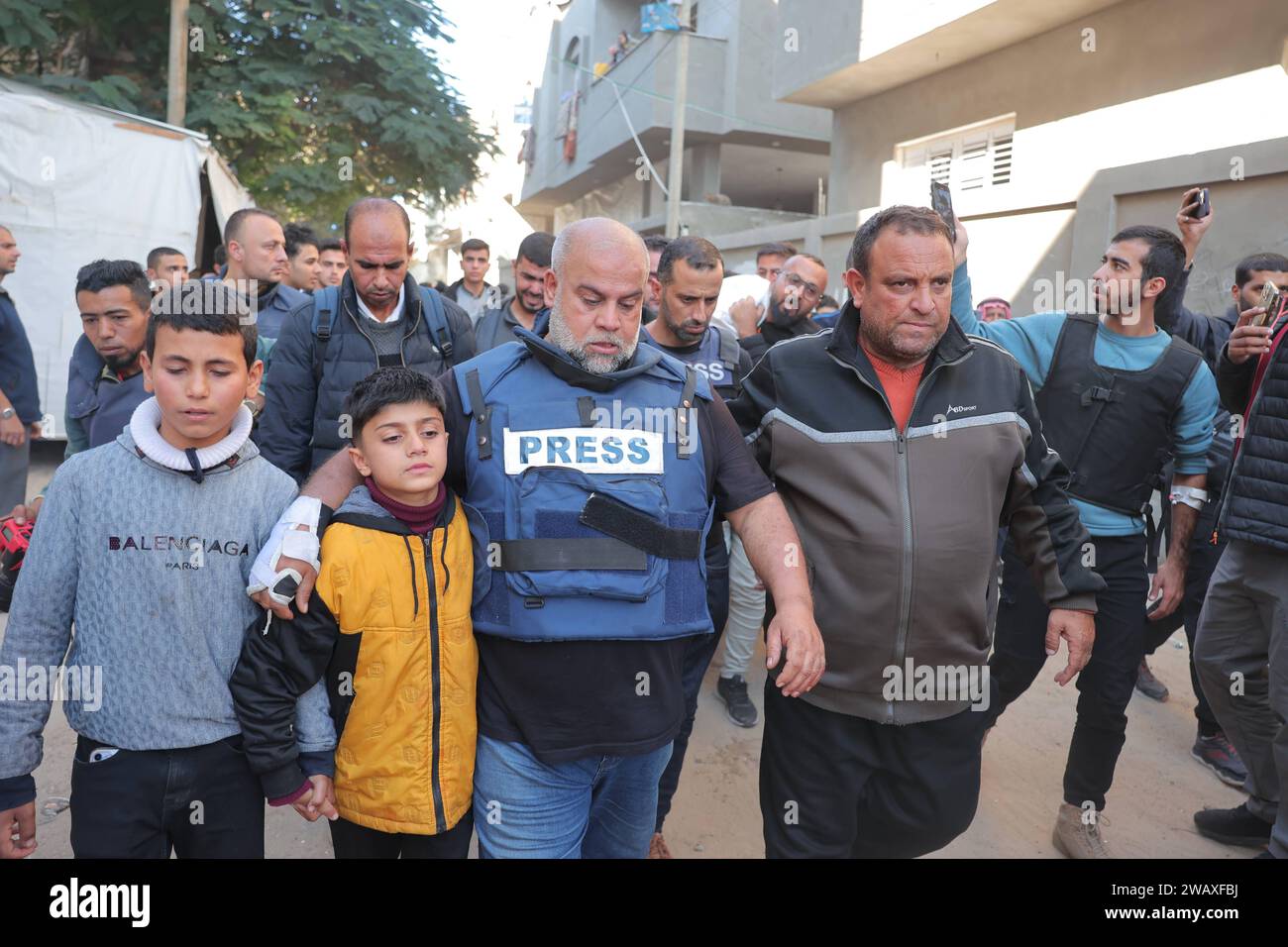 Palestinians attend in the funeral of Hamza Wael Dahdouh, a journalist ...