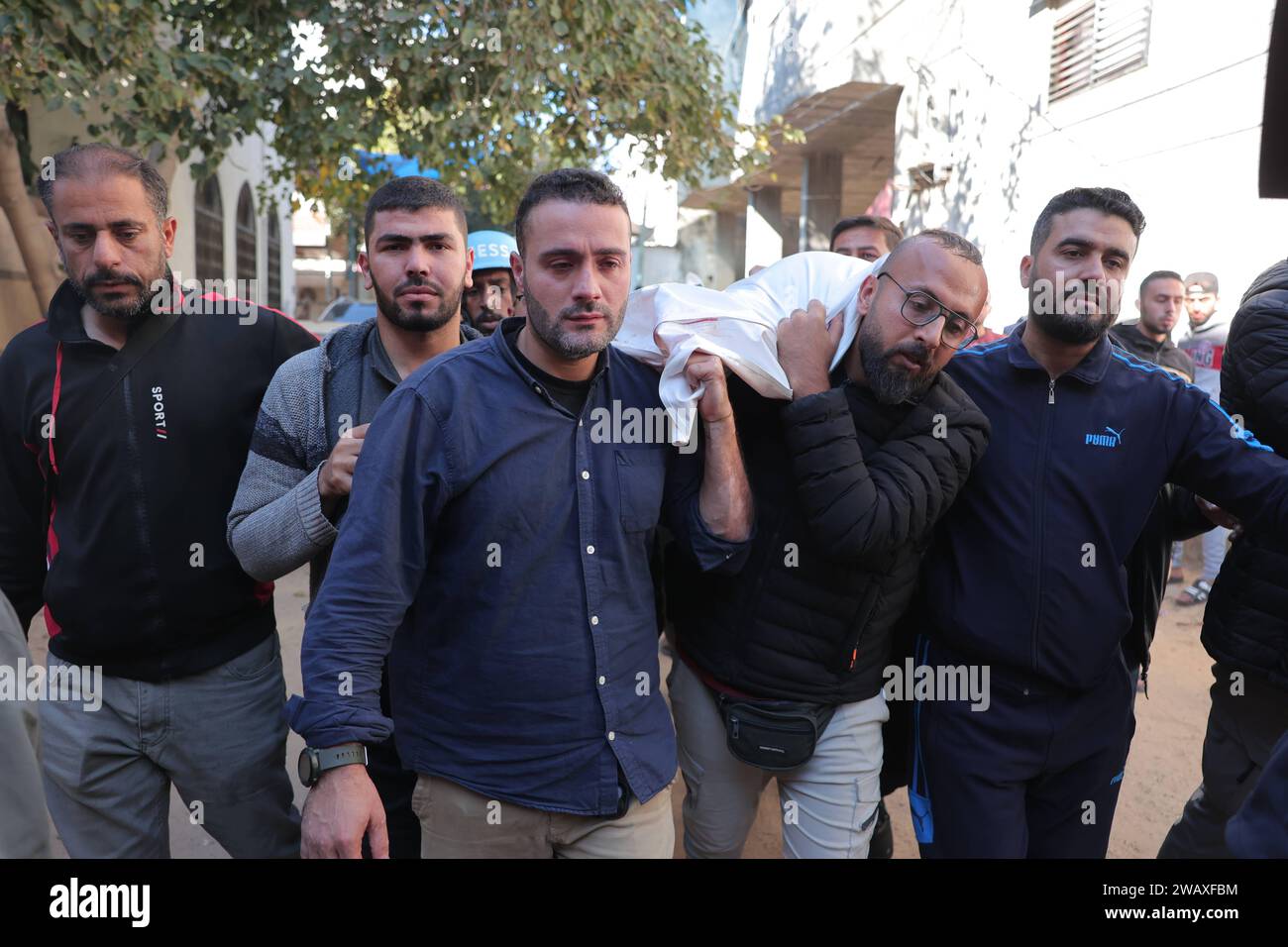 Palestinians attend in the funeral of Hamza Wael Dahdouh, a journalist ...