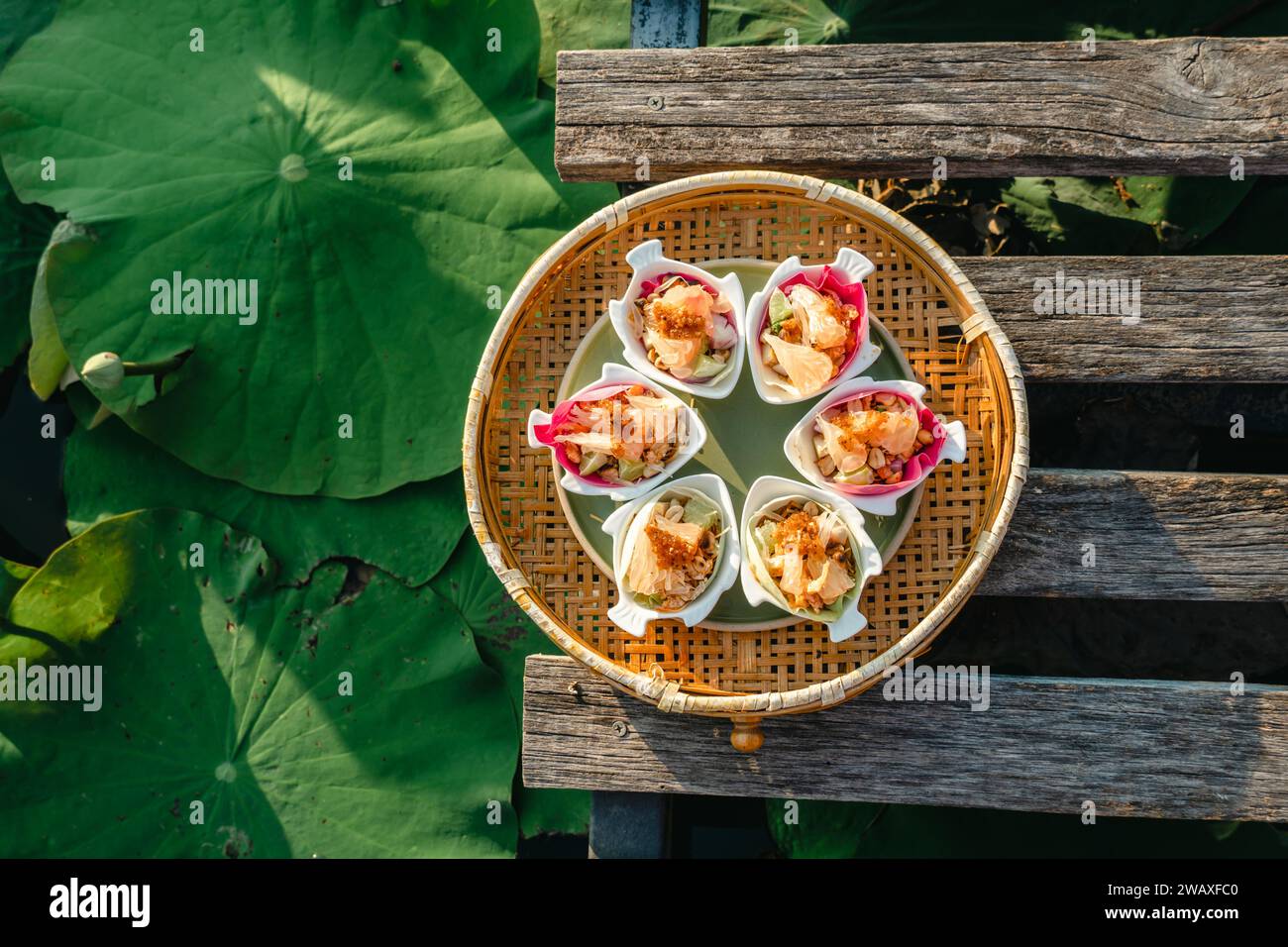 Traditional Thai snack called Miang Kham, savoury pink lotus petal ...