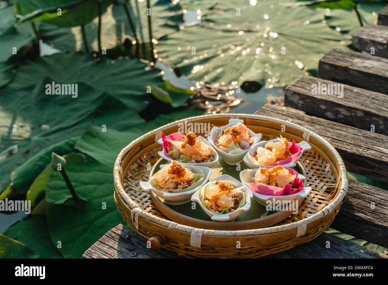 Traditional Thai snack called Miang Kham, savoury pink lotus petal ...