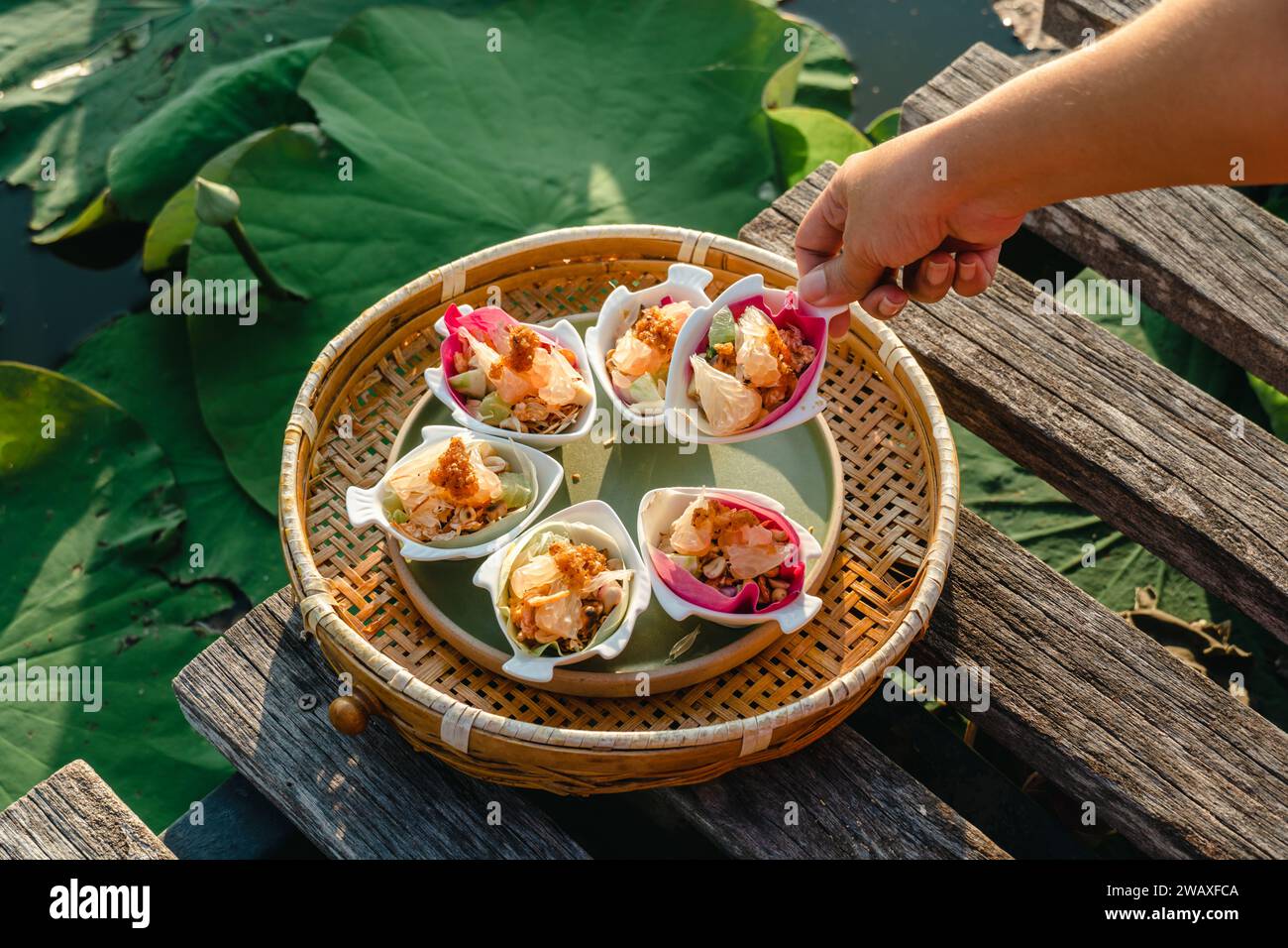 Traditional Thai snack called Miang Kham, savoury pink lotus petal ...