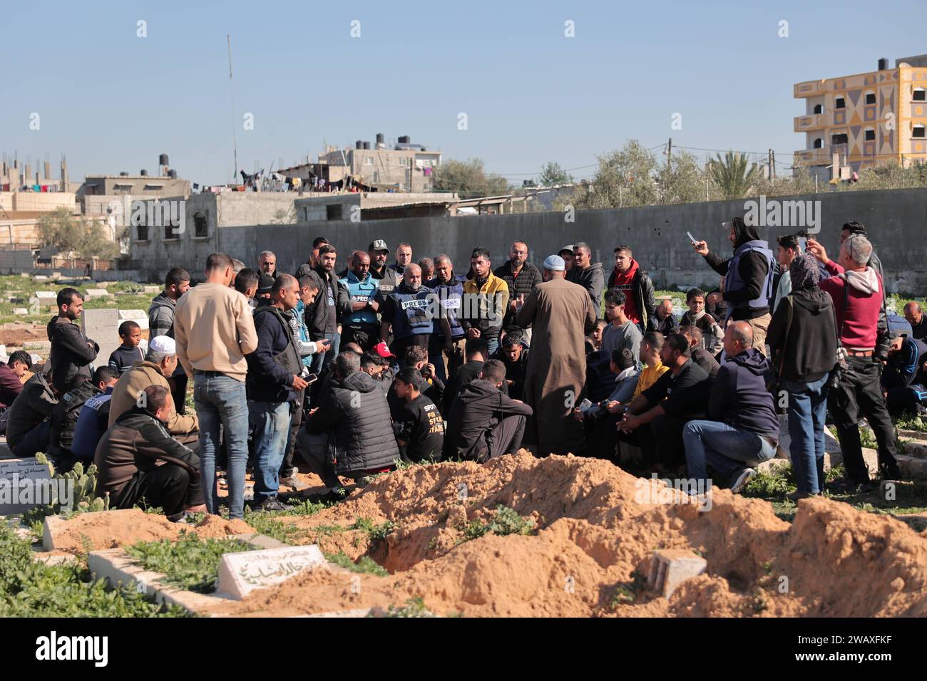 Al Jazeera s bureau chief in Gaza, Wael Al-Dahdouh is comforted during ...