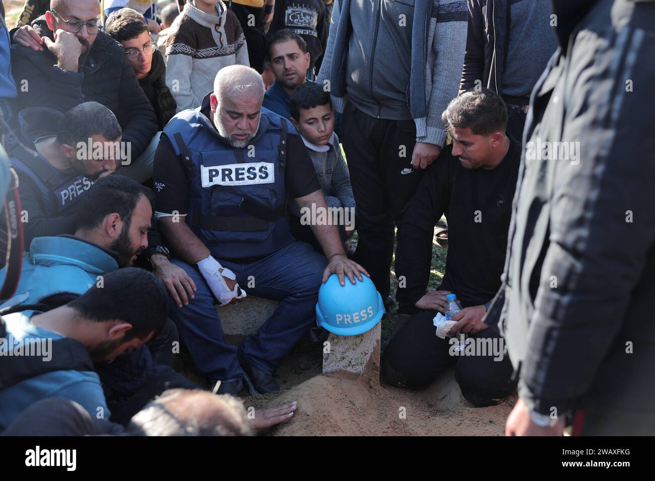 Palestinians attend in the funeral of Hamza Wael Dahdouh, a journalist ...