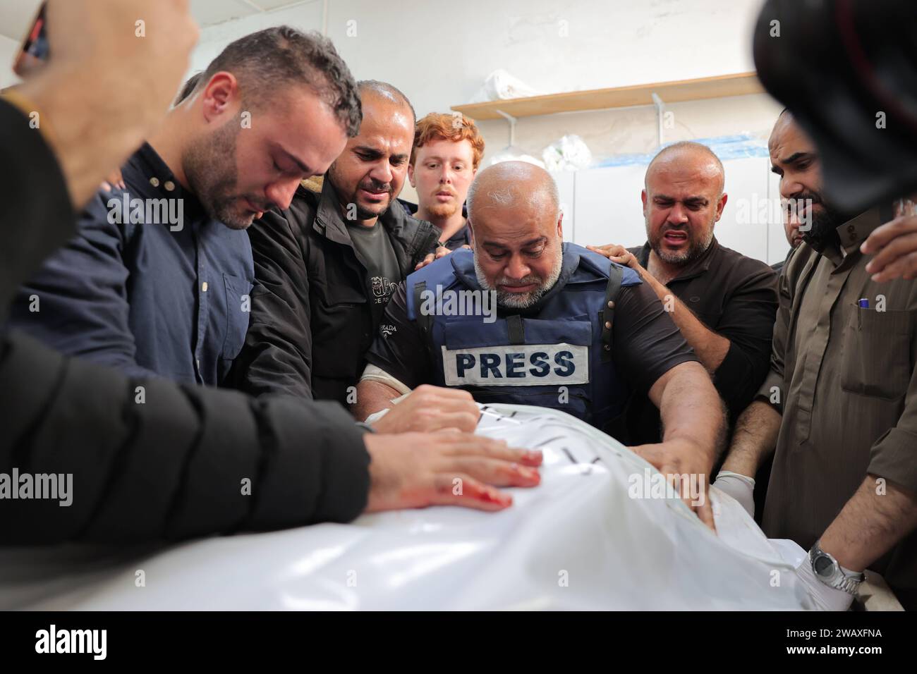 Palestinians attend in the funeral of Hamza Wael Dahdouh, a journalist ...