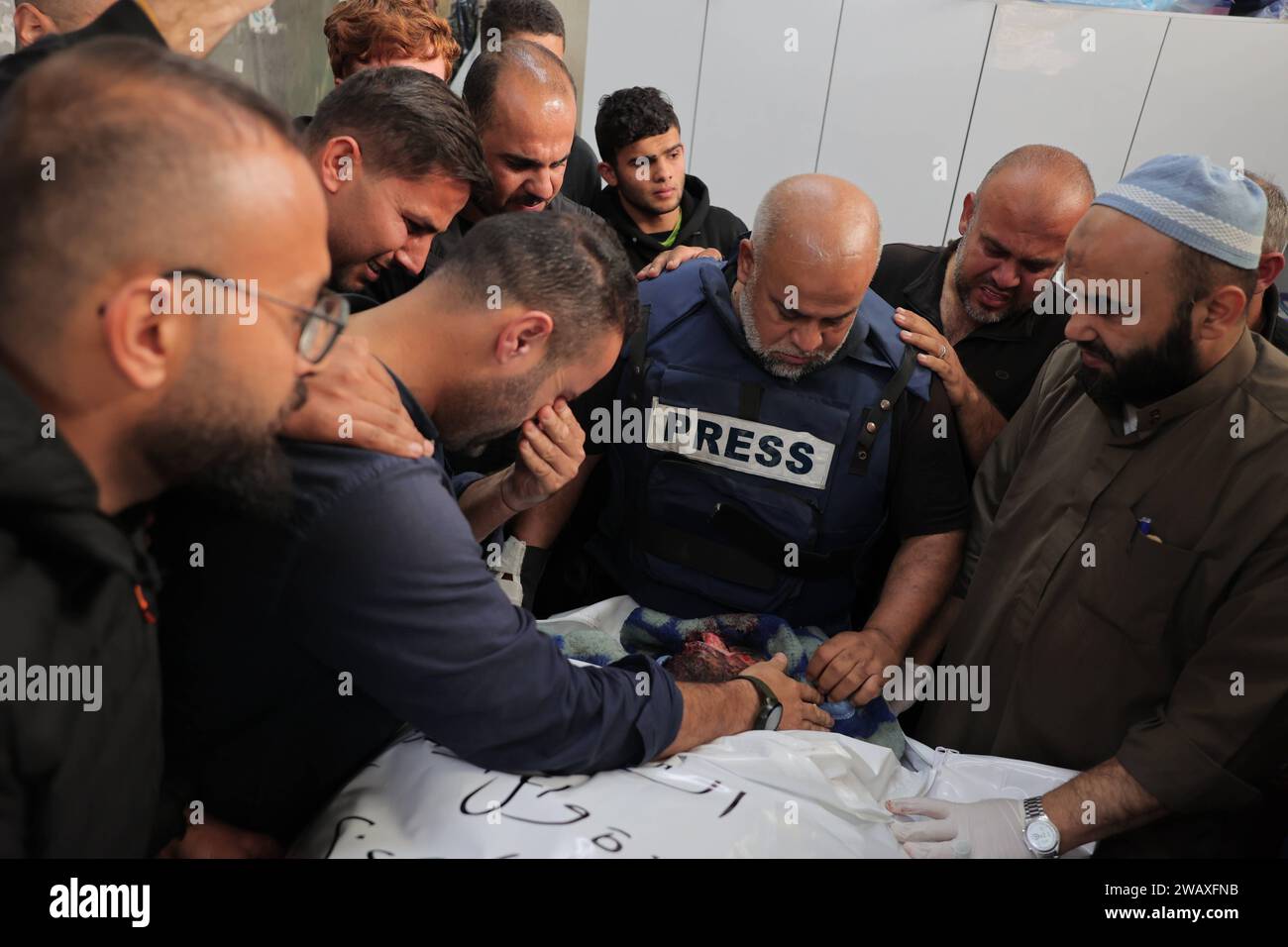 Palestinians attend in the funeral of Hamza Wael Dahdouh, a journalist ...