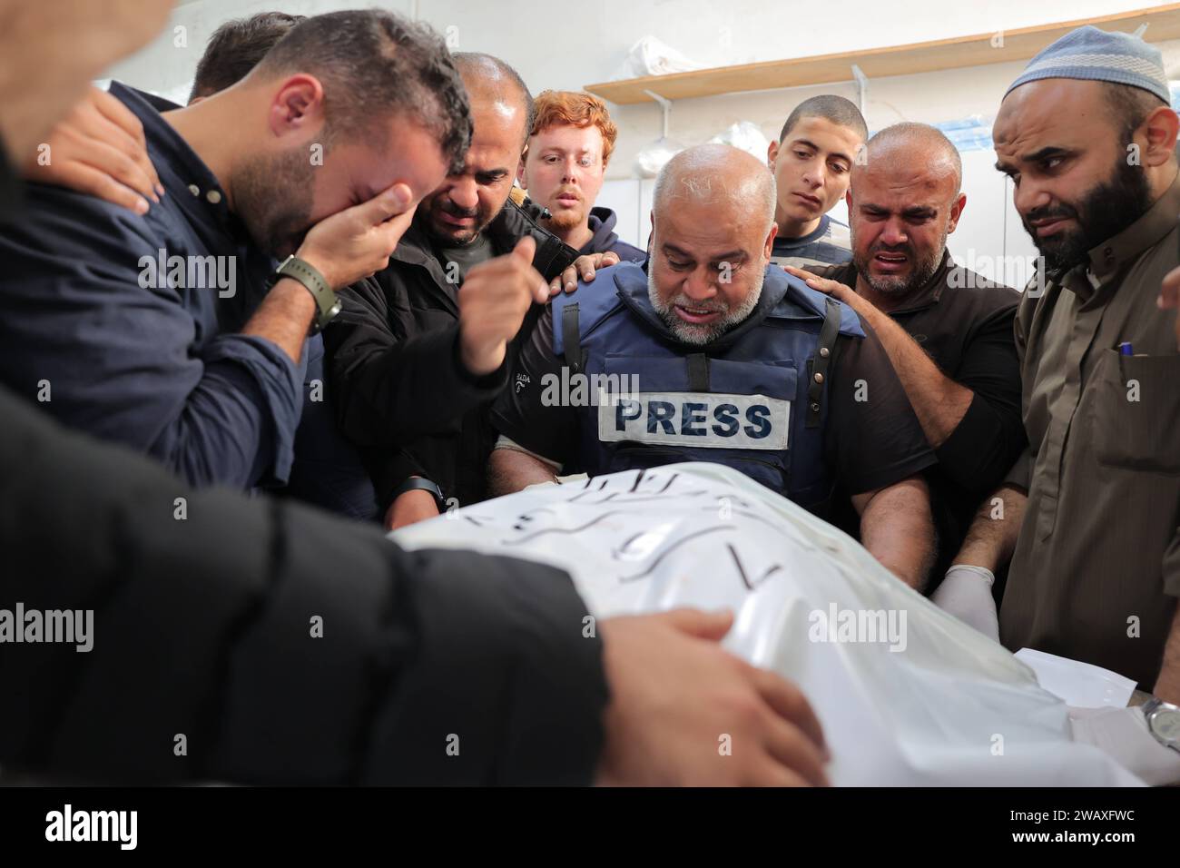 Palestinians attend in the funeral of Hamza Wael Dahdouh, a journalist ...