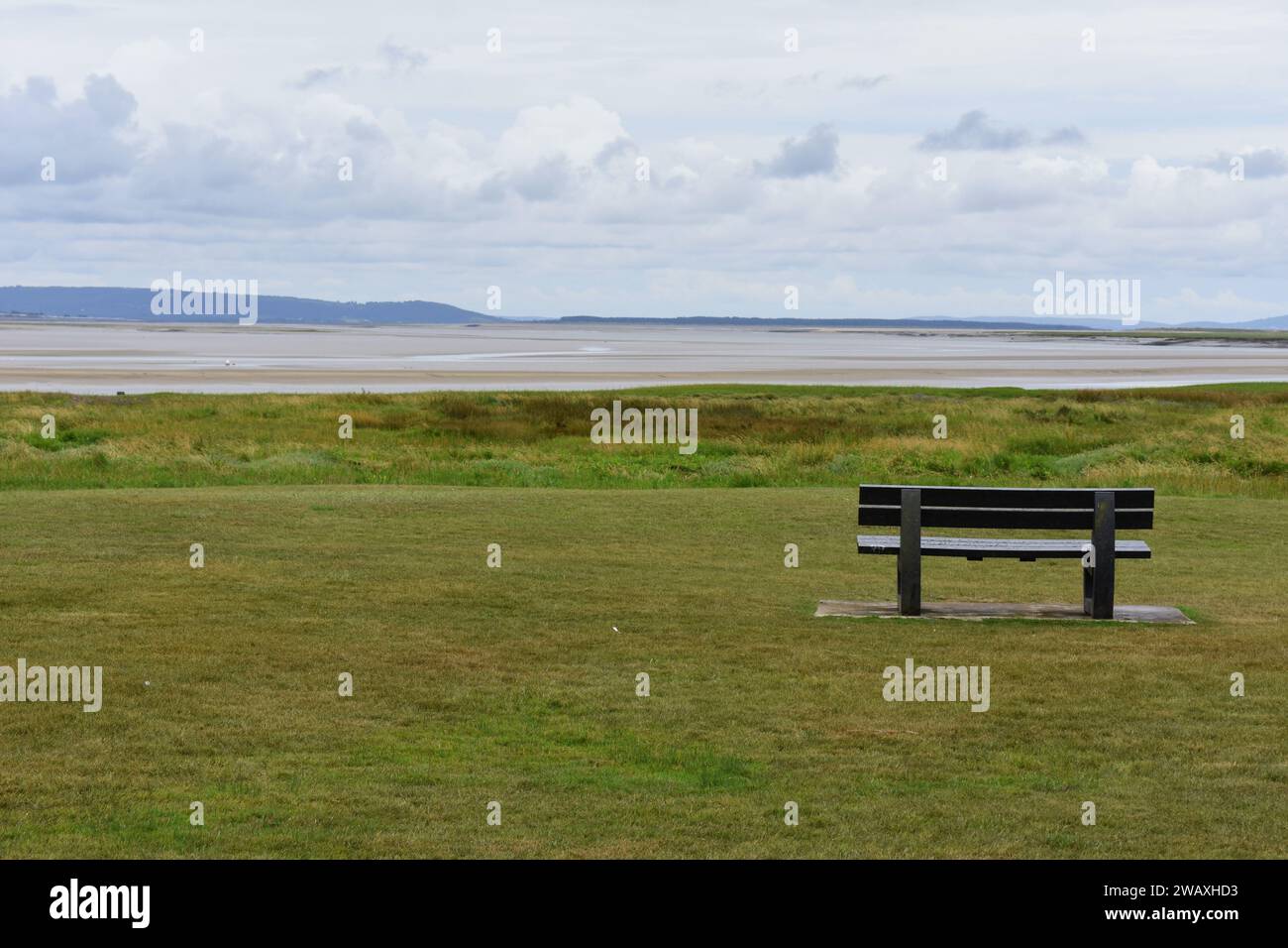 Public bench with a view across the river Taf estuary, Laugharne ...