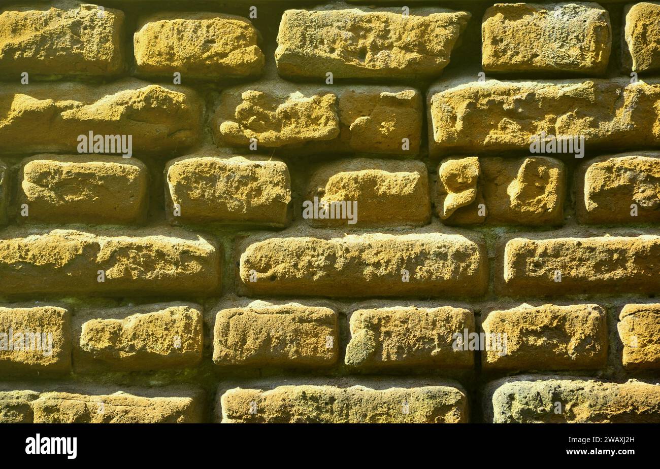 Horizontal wall texture of several rows of very old brickwork made of ...
