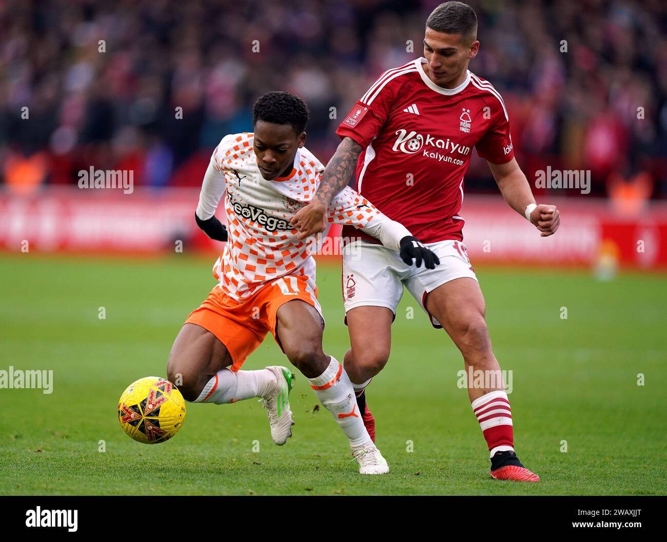 Nottingham Forest's Nicolas Dominguez and Blackpool's Karamoko Dembele ...