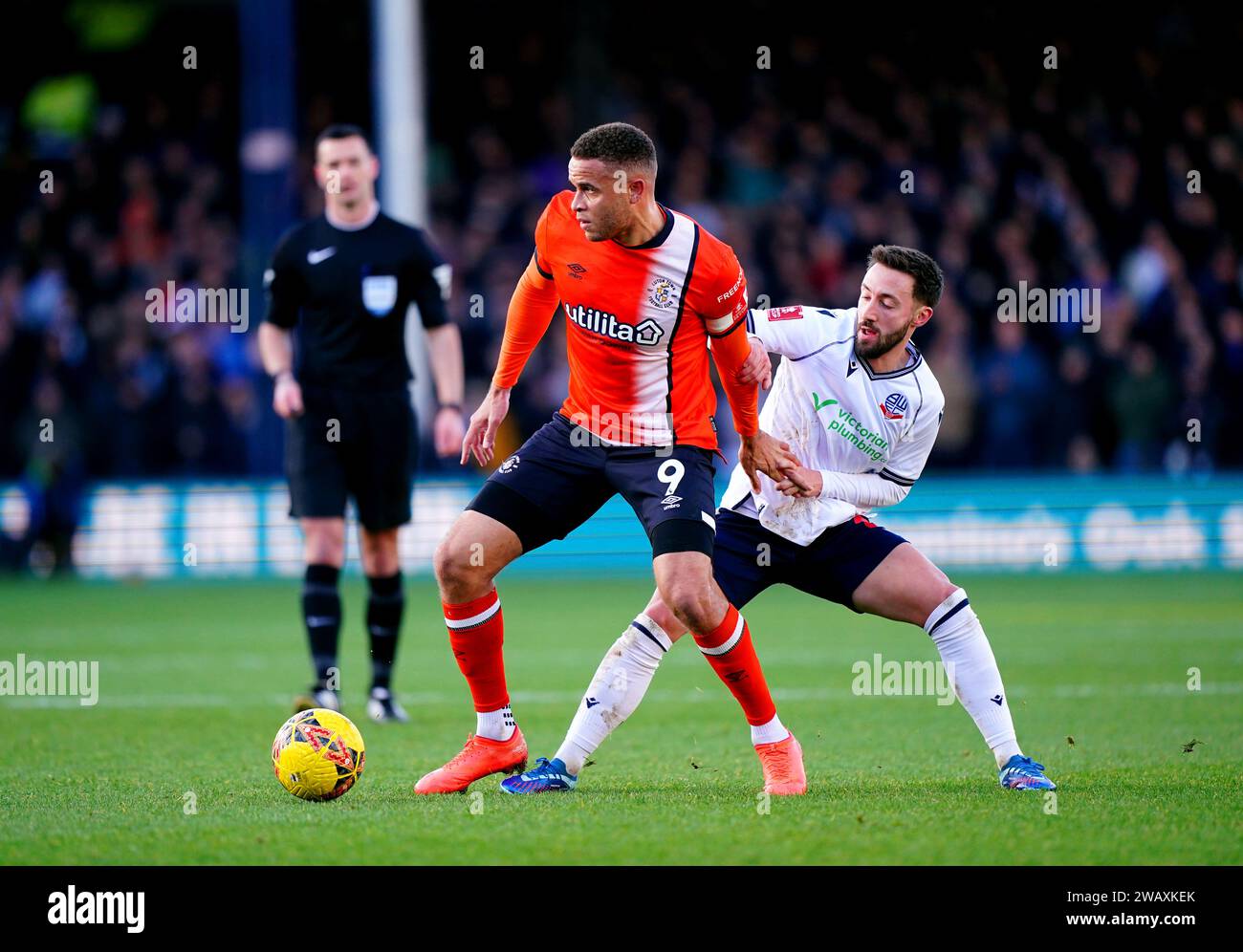 Luton Town's Carlton Morris (left) and Bolton Wanderers' Josh Sheehan ...