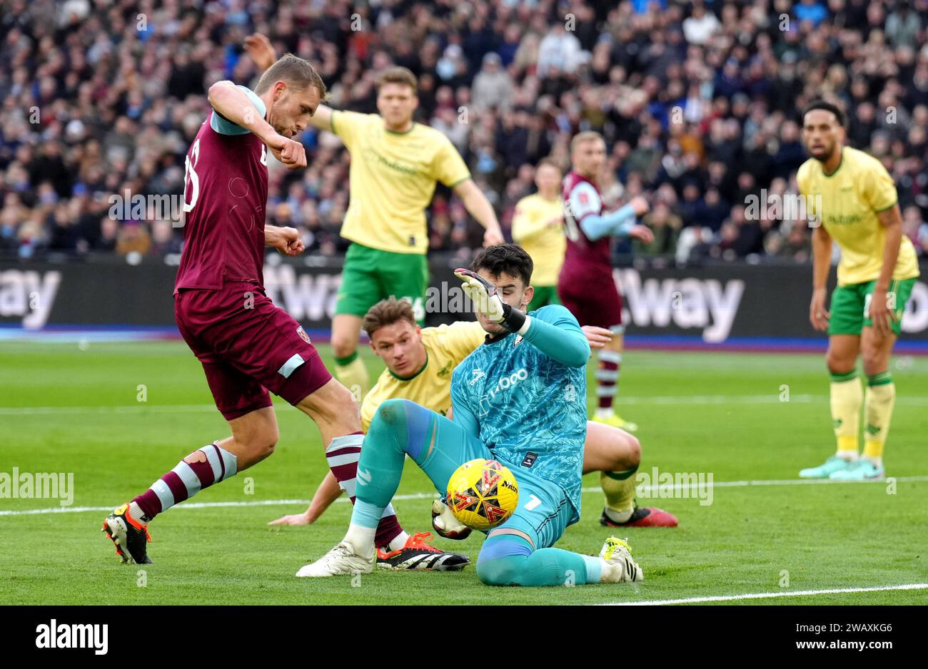 Bristol City goalkeeper Max O'Leary makes a save from West Ham United's ...