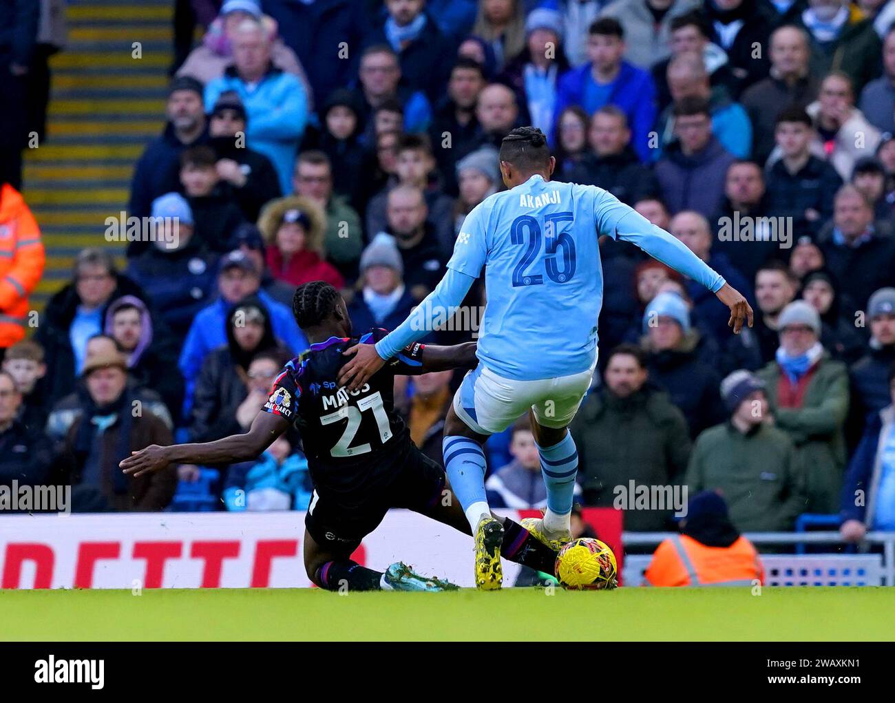 Manchester City's Manuel Akanji is tackled by Huddersfield Town's Alex ...