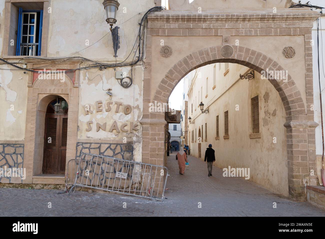 Historic gate in the medina in the city of Essaouira with shop sign on ...