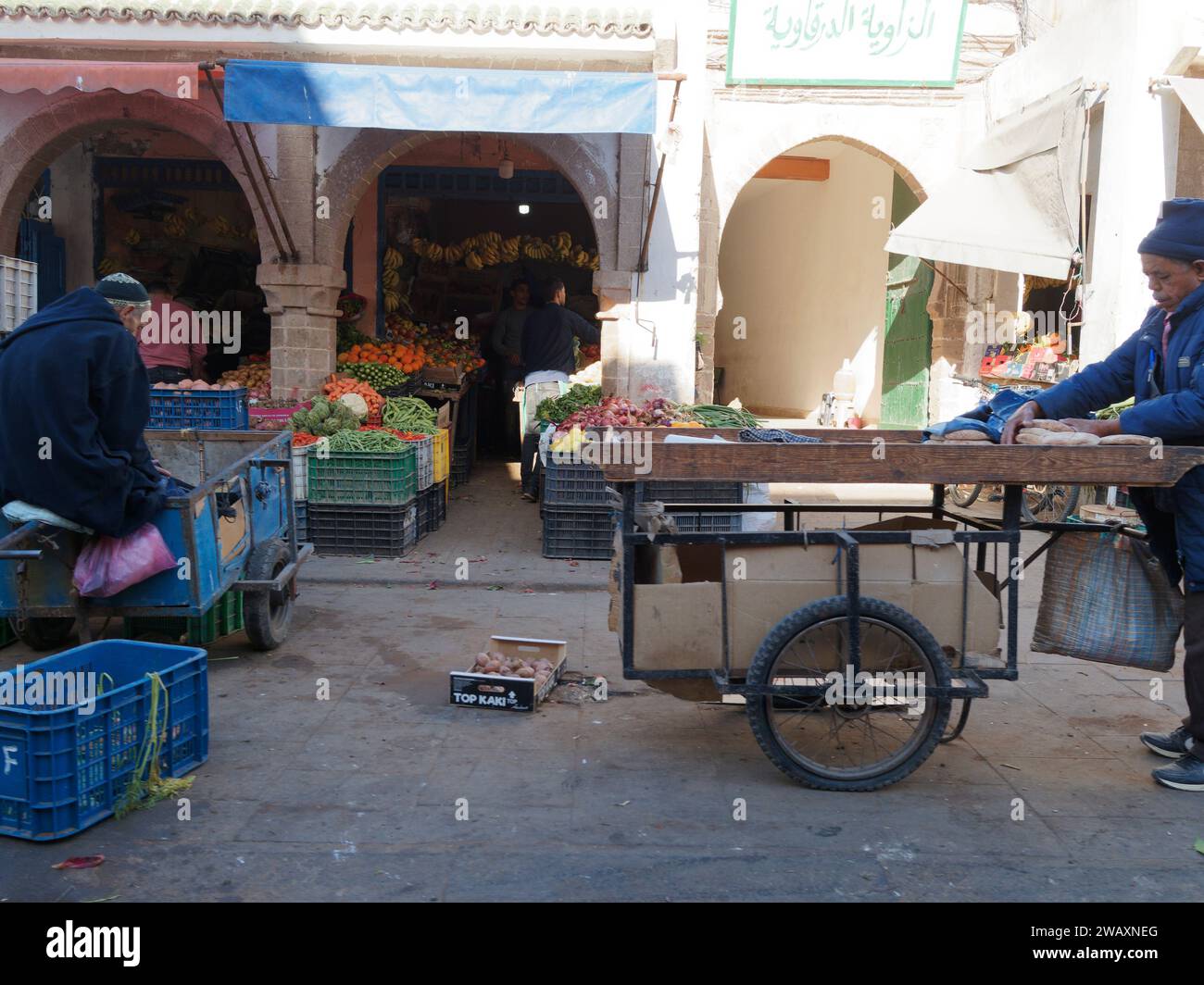 Fruit and Veg shop and bread being sold from a cart in the historic ...