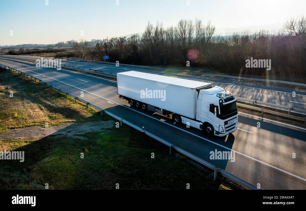 Big white delivery truck on the road with sunset countryside,fast ...