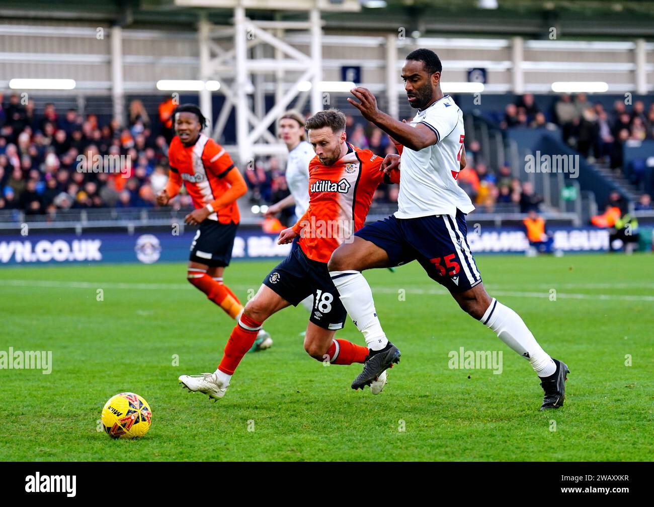 Luton Town's Jordan Clark (left) and Bolton Wanderers' Cameron Jerome ...