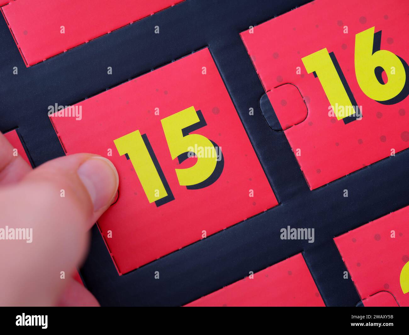 A woman hand opening a door with number 15 on an advent calendar Stock ...