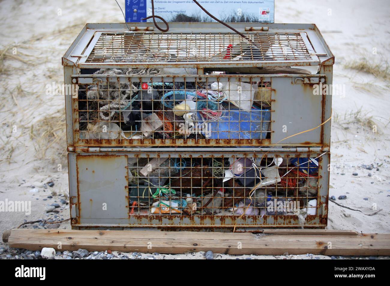 Mesh box on the beach in Heligoland for stranded plastic waste Stock ...