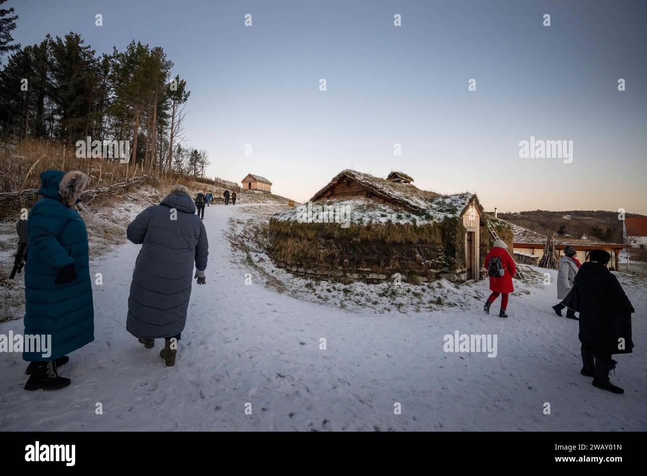 People walk around a Sami settlement during a visit to the medieval ...