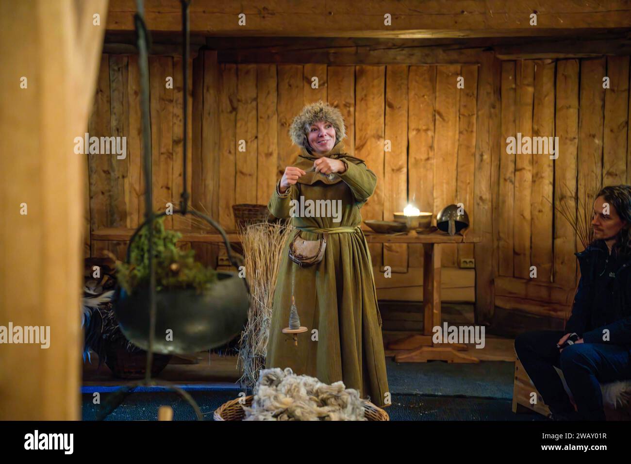 A woman dressed in Sami clothes shows some ways of preserving products ...