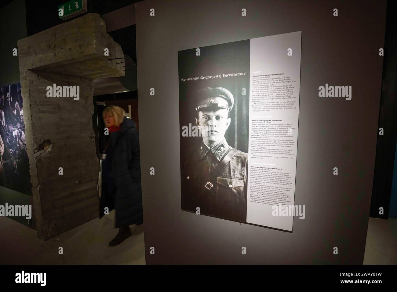 A woman walks through one of the rooms displaying World War II ...
